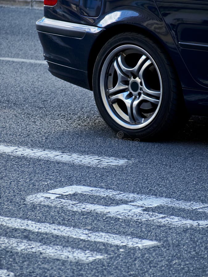 Car Tyre Against a Curb on a Pavement Stock Photo - Image of wheel ...