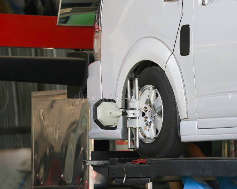 Car Wheel Fixed with Computerized Wheel Alignment Machine Clamp Stock ...