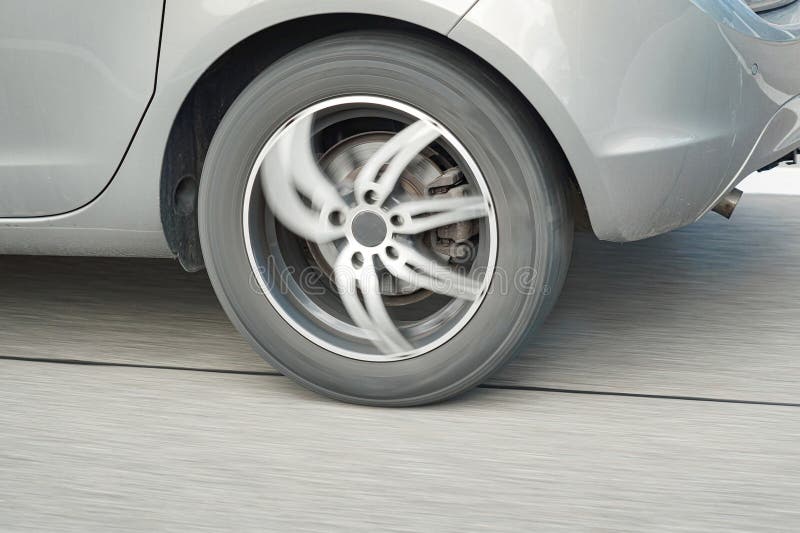 Car Wheel in Motion on the Road, Brake Caliper Stock Image - Image of ...