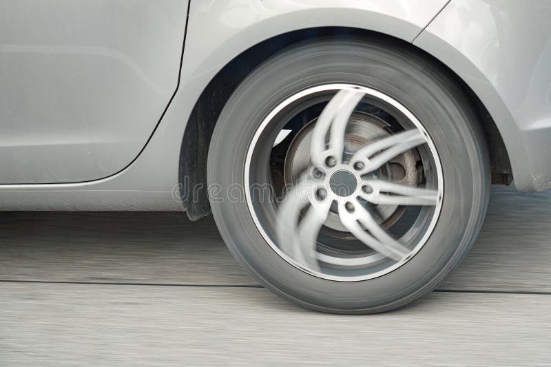 Car Wheel in Motion on the Road, Brake Caliper Stock Image - Image of ...