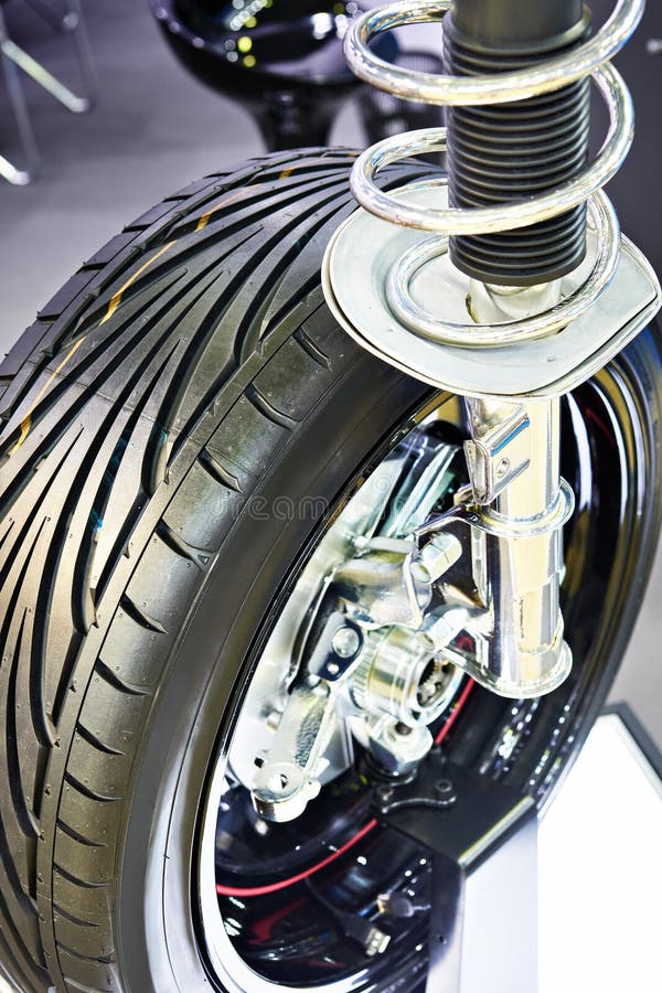 Car Wheel, Shock Absorber, Caliper and Brake Disc Assembly Stock Photo ...
