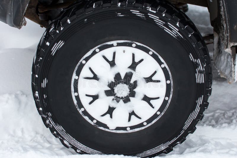 A car wheel in the snow. stock photo. Image of wheel - 231103246