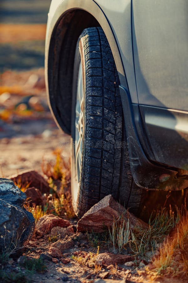 Car Wheel Standing Offroad on Stone Close-up View Stock Photo - Image ...