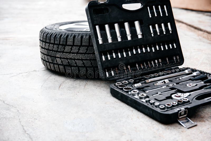 Car Wheel with Tools Box on Asphalt Background. Stock Image - Image of ...