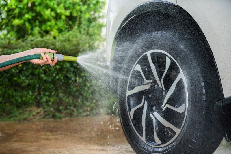 Car Wheel Washing with Spray Water Stock Image - Image of tube, vehicle ...