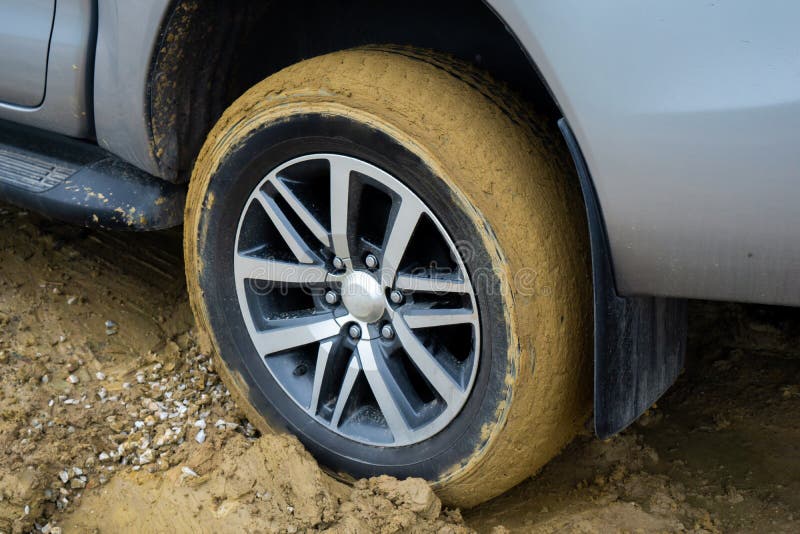 Car wheels stuck in mud. stock photo. Image of adventure - 201432082