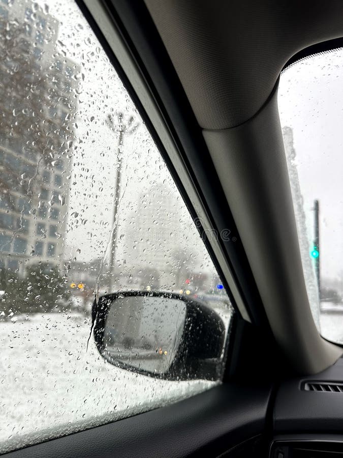 The Car Window from the Inside is in Motion in the City. the Traffic ...