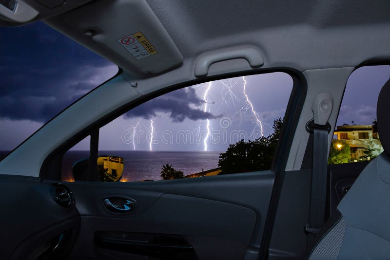 Car Window with View of Lightning Storm Over the Sea Stock Photo ...