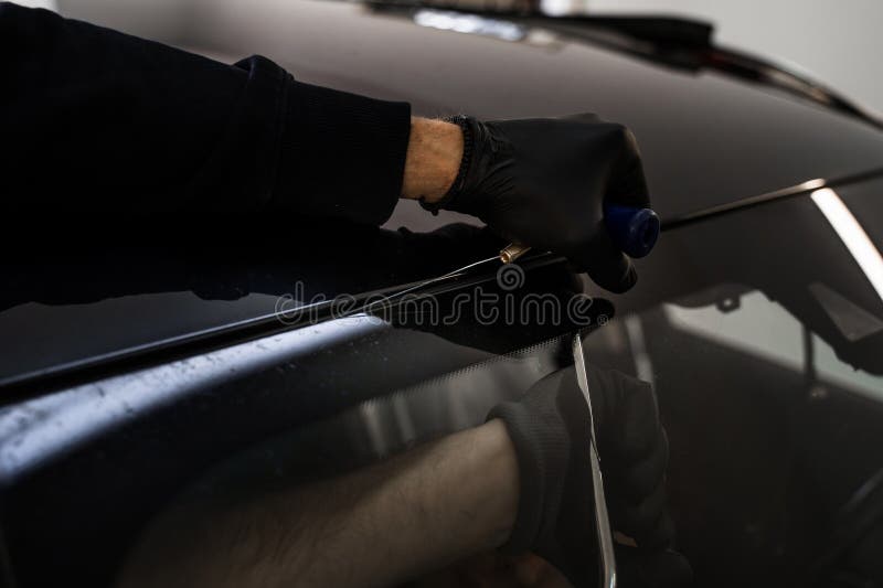 Car Windshield Replacement Process. Windshield Removal in Progress ...