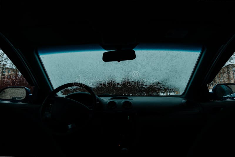 Car Windshield Thawed. Snow Thawing on a Windshield of a Car Stock ...
