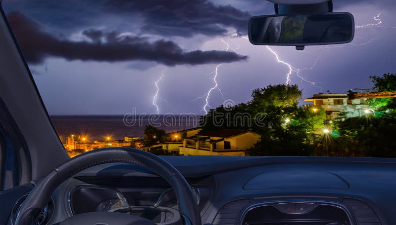 Car Windshield with View of Lightning Storm Over the Sea Stock Image ...