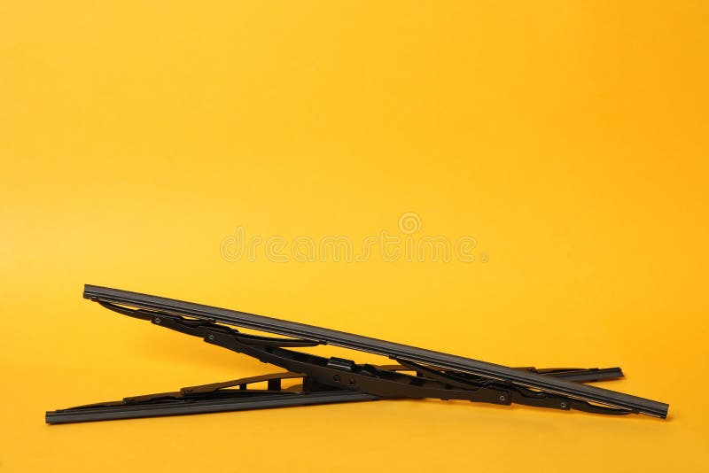 Car Windshield Wipers on Yellow Background. Space for Text Stock Photo ...