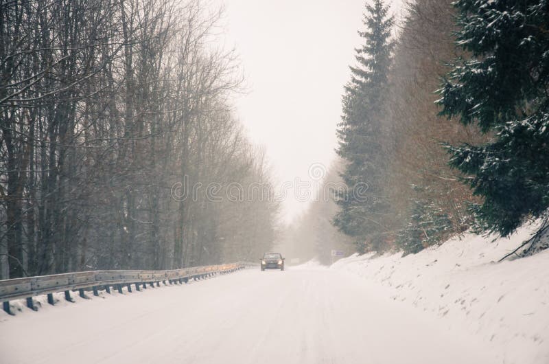 Car in Winter Forest with Snow Cover on Trees and Road Stock Image ...