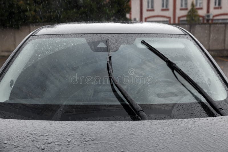 Car Wipers Cleaning Water Drops from Windshield Glass Outdoors, Closeup ...