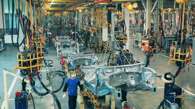 A Guy Moving Chains with Weights Up and Down Performing a Task in the ...