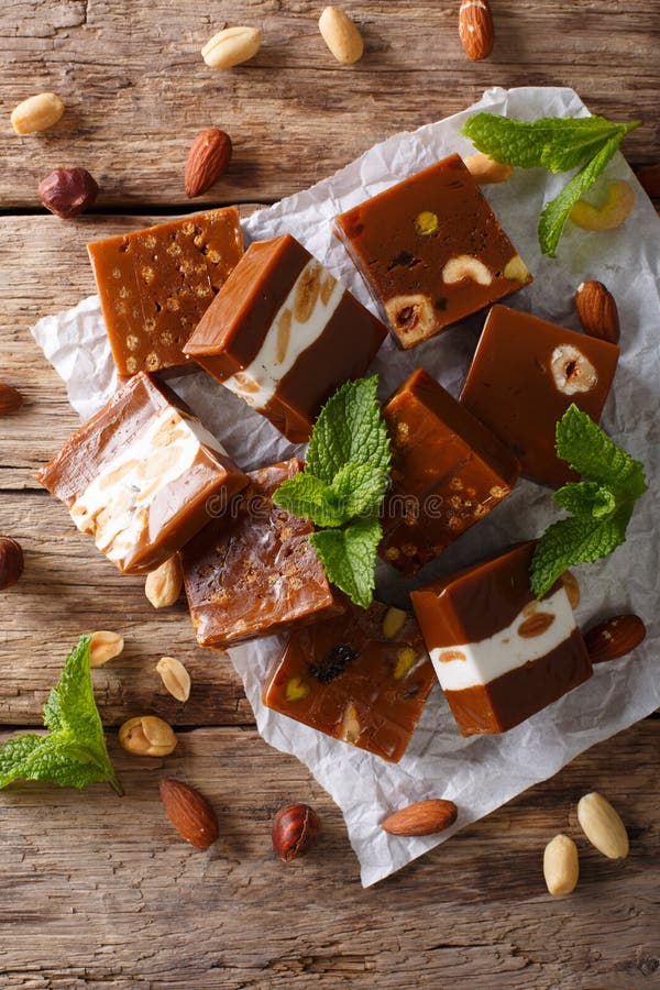 Caramel Candy with Nuts Close-up on the Table. Vertical Top View Stock ...