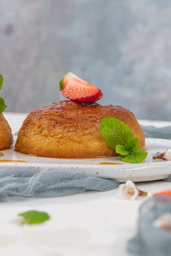 Caramel Custard Pudding on Plate Over Modern Background with Copy Space ...