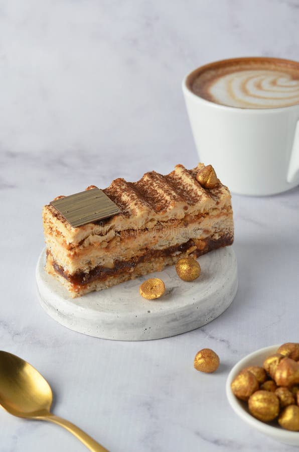 Caramel and Hazelnut Cake, Dacquoise Cake on Bright Background Stock ...