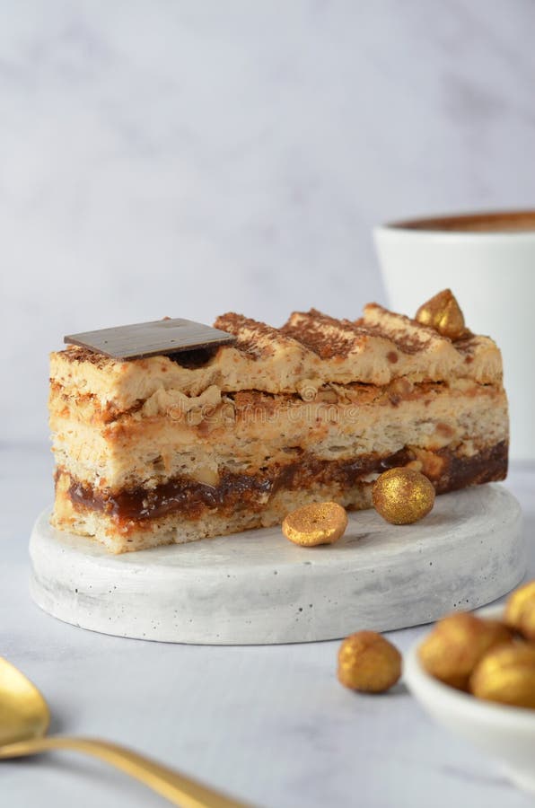 Caramel and Hazelnut Cake, Dacquoise Cake on Bright Background Stock ...