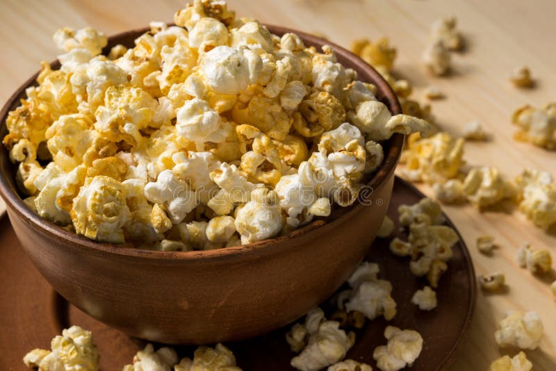 Caramel Popcorn in a Clay Bowl on a Wooden Table Top. Stock Photo ...