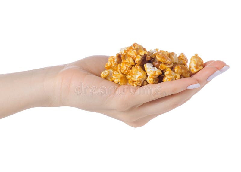 Caramel popcorn in hand stock photo. Image of holiday - 108548486