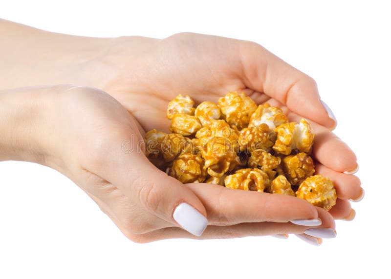 Caramel popcorn in hand stock image. Image of delicious - 108548559