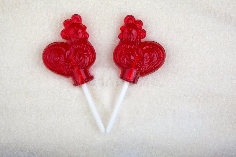 Caramel red rooster stick stock photo. Image of design - 135823434