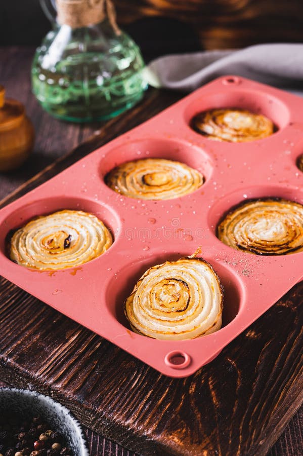 Caramelized Baked Onion Halves in a Baking Dish on the Table Vertical ...