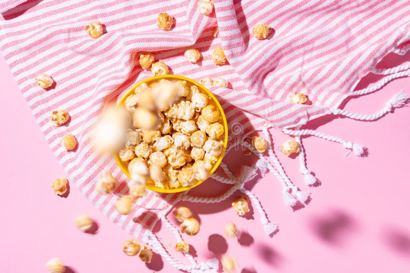 Caramelized Popcorn Dropping Down into a Yellow Bowl Stock Photo ...
