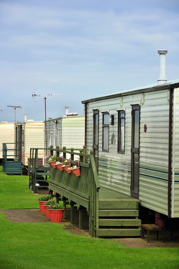 Caravan Camp on Green Grass Under Clouds Stock Image - Image of ...