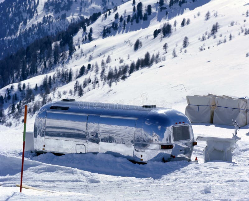 A Caravan in the Snow Covered Landscape in the Alps Switzerland Stock ...
