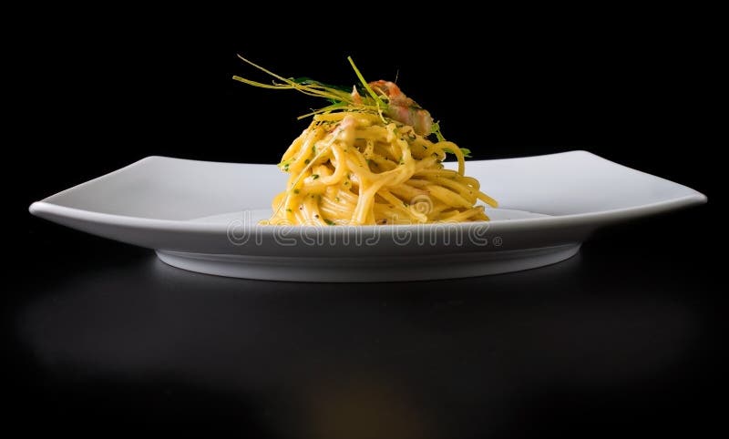 Chef Neatly Plating Spaghetti Carbonara in Cheese Wheel on White Plate ...