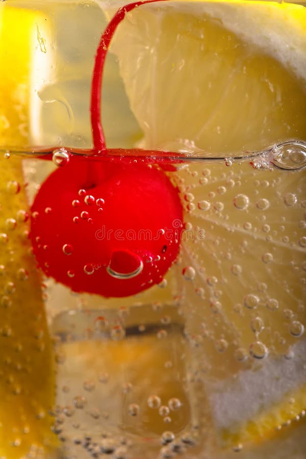 Carbonated Drink with Lemon and Sweet Cherry Stock Photo - Image of ...