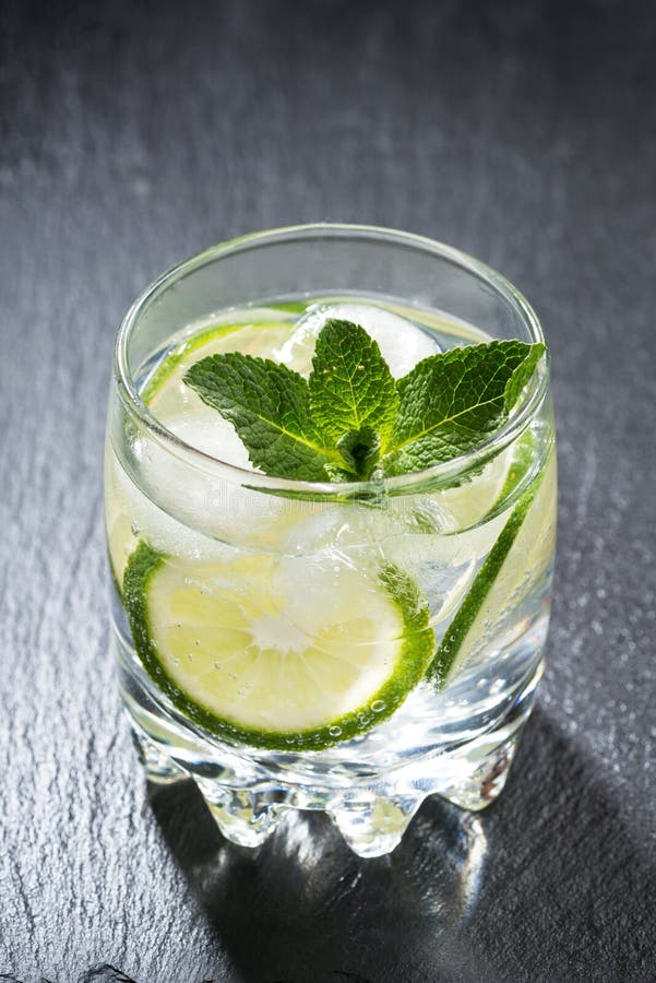 Carbonated Lemonade with Ice in a Glass, Vertical Stock Image - Image ...