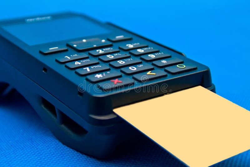 Card Machine or Terminal with a Blank Yellow Credit Card Inserted, on a ...