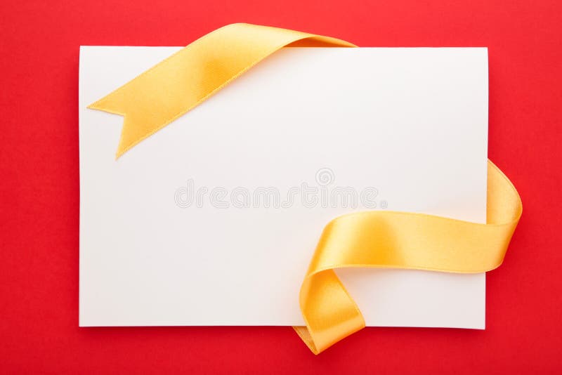 Card Note with Shiny Gold Ribbon on Red Background Stock Image - Image ...