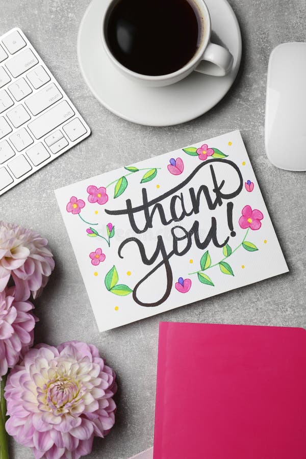 Card with Phrase Thank You, Dahlias, Coffee and Notebook on Grey Table ...