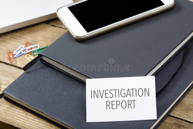 Card Saying Investigation Report on Note Pad Stock Photo - Image of ...