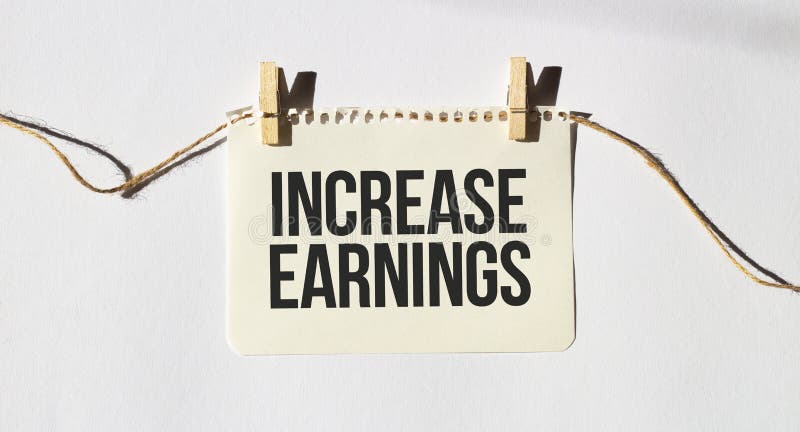 INCREASE EARNINGS Text on Clipboard on White Background, Business ...