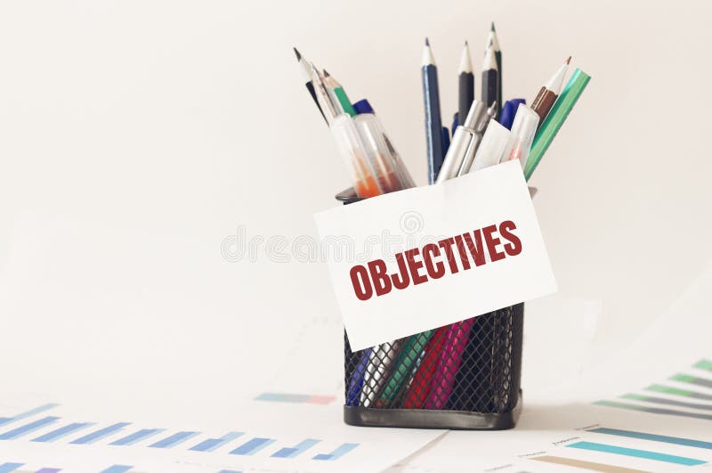 The Text OBJECTIVES Appearing Behind Torn Brown Paper Stock Photo ...