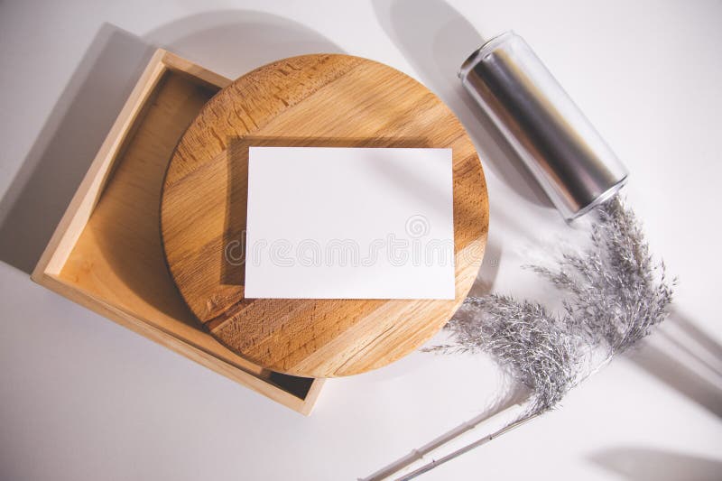 Card on a Wooden Plate with Grass Stock Image - Image of white, paper ...