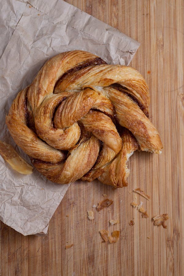 Cardamom Bun Twist on Paper Bag with Bite Out Stock Image - Image of ...