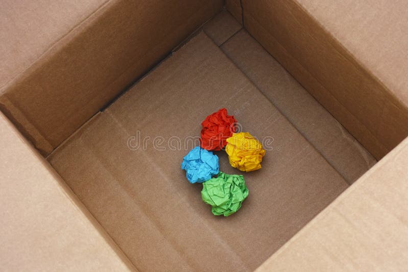 A Cardboard Box with Crumpled Colorful Paper Balls Inside Stock Image ...