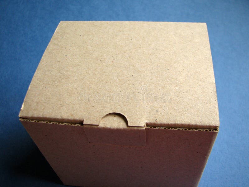 Cardboard Box on a Dark Blue Background Stock Image - Image of ...