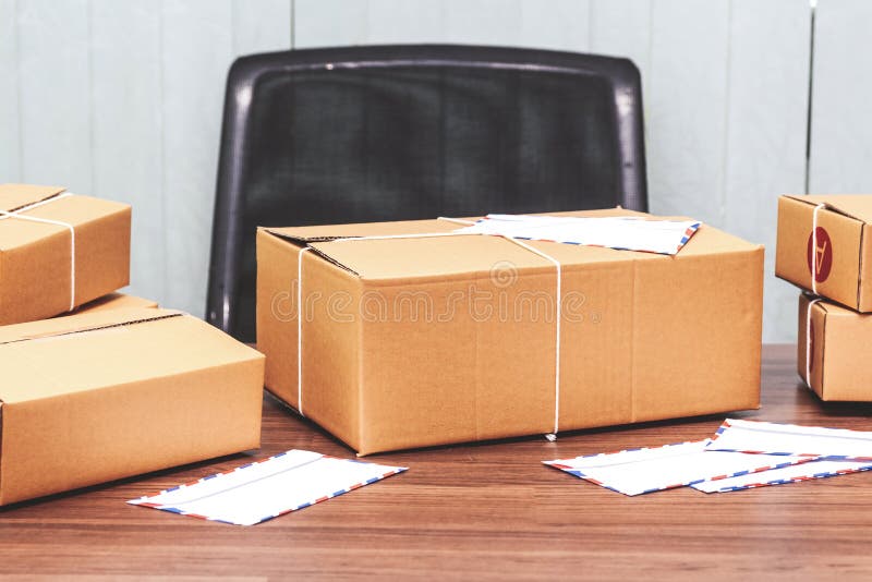 Cardboard Box for Delivery on Wooden Table Stock Photo - Image of post ...