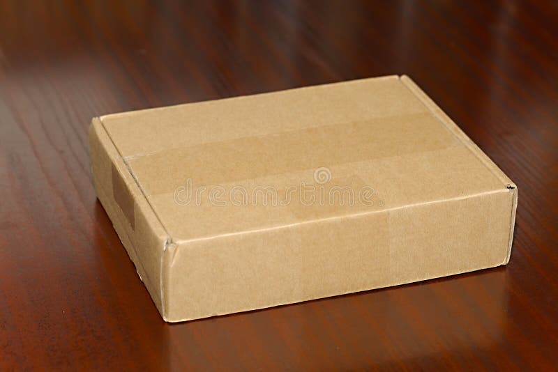 Cardboard Box on Desk stock image. Image of postal, post - 70363521
