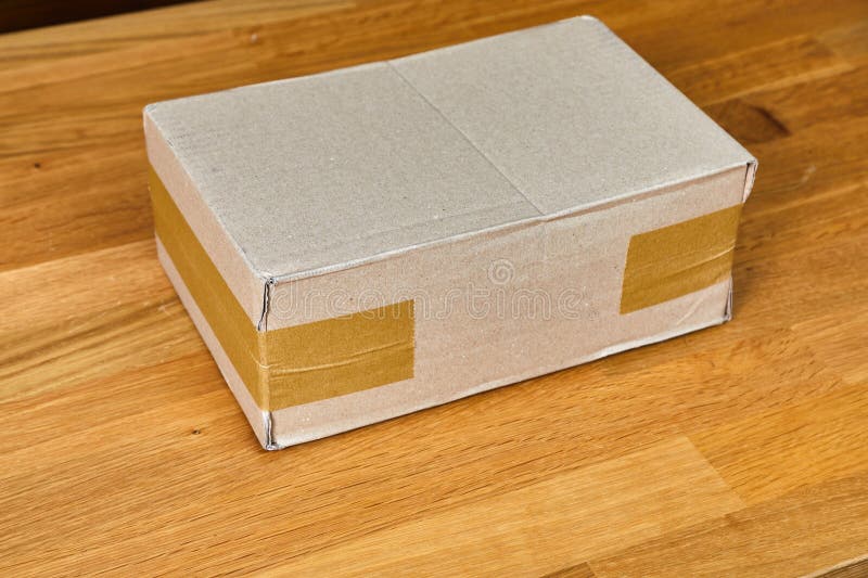 Cardboard Box on Desk stock photo. Image of beige, logistics - 378039160