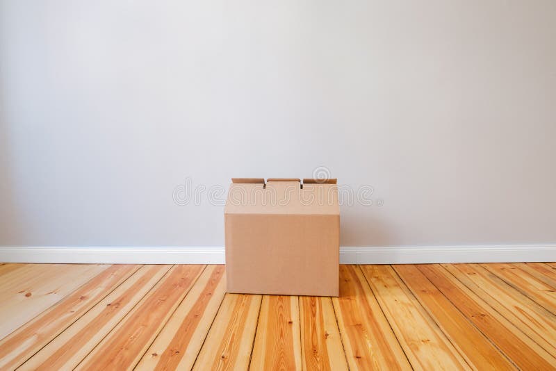 Cardboard Box in Empty Room,on Wooden Floor in New Flat Stock Photo ...