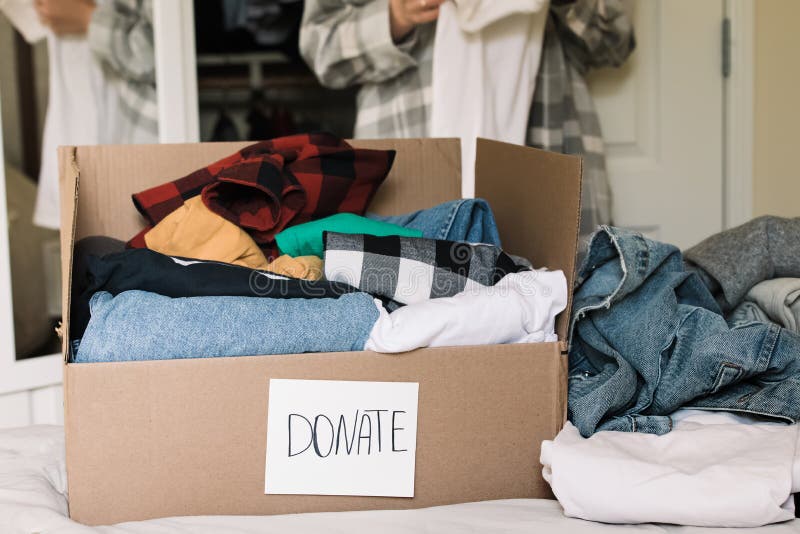Cardboard Box Full of Clothes To Donate Stock Photo - Image of pile ...