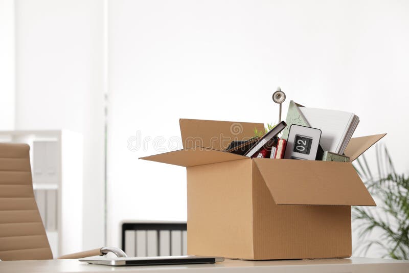 Cardboard Box Full of Stuff on Table Stock Photo - Image of belongings ...